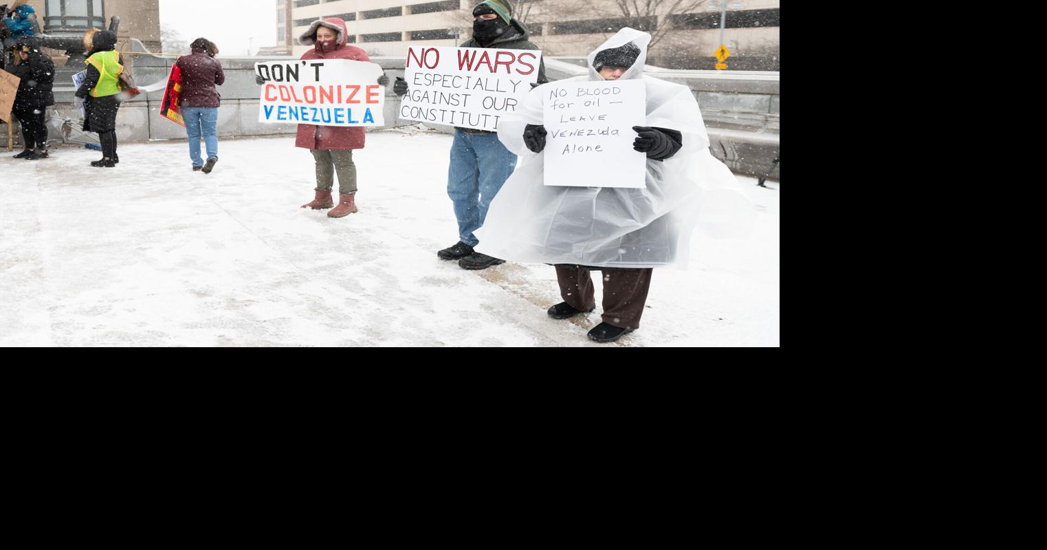 Dozens of protesters demonstrate in snowy weather outside of meeting ...