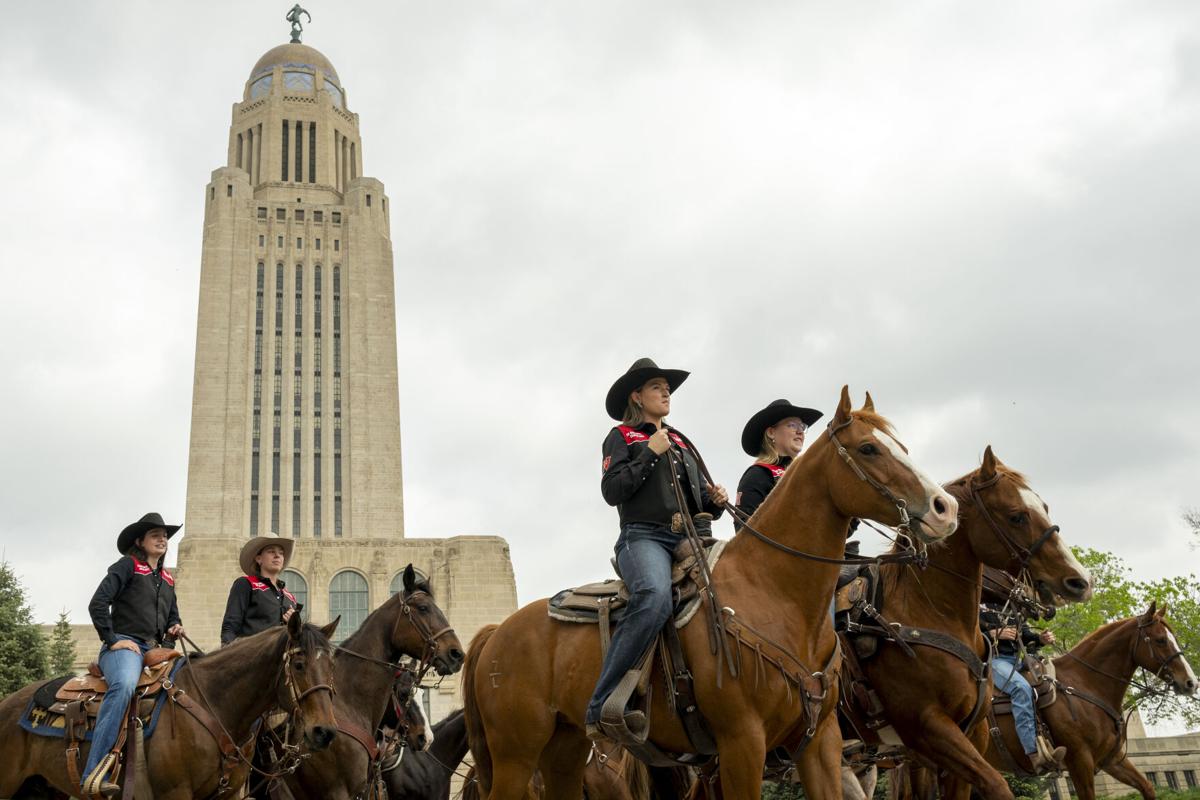 Gov. Pillen back on horse; Coach Cook donates to UNL Rodeo