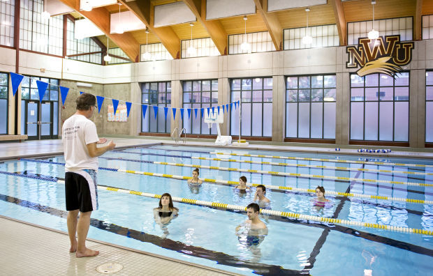NWU students learning music conducting in the pool
