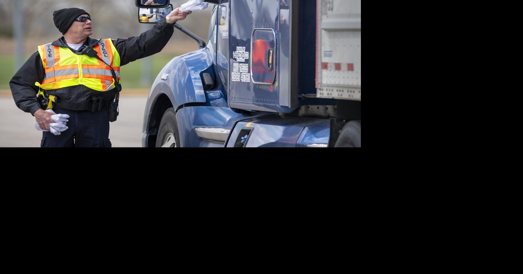 Nebraska troopers hand out 100,000 cloth face masks to truckers passing ...