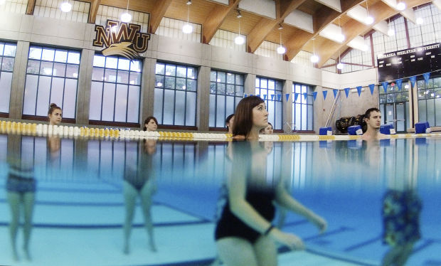 NWU students learning music conducting in the pool