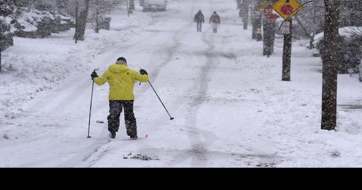 Winter storm sweeps Northeast, cutting power, closing schools