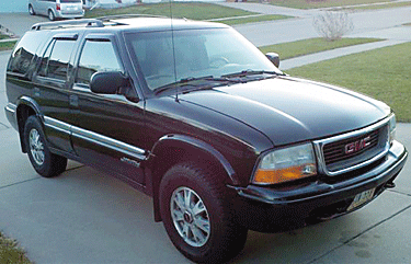 GMC Jimmy, 2001 - SLT, 4x4, black w/tan leather interior.