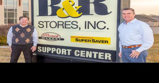 Pat Raybould and Mark Griffin pose in front of B&R sign