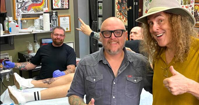 Mike Geier, aka Puddles Pity Party, gets inked at Iron Brush