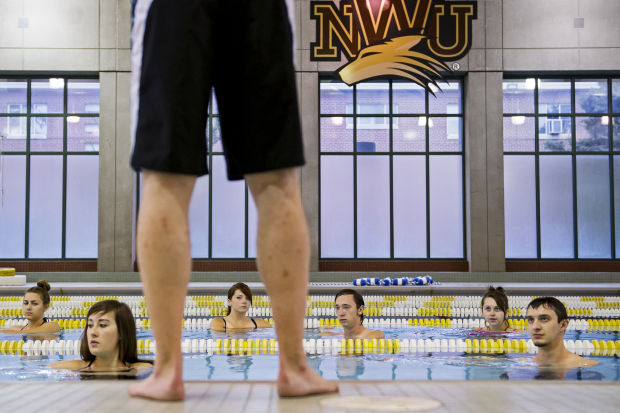 NWU students learning music conducting in the pool