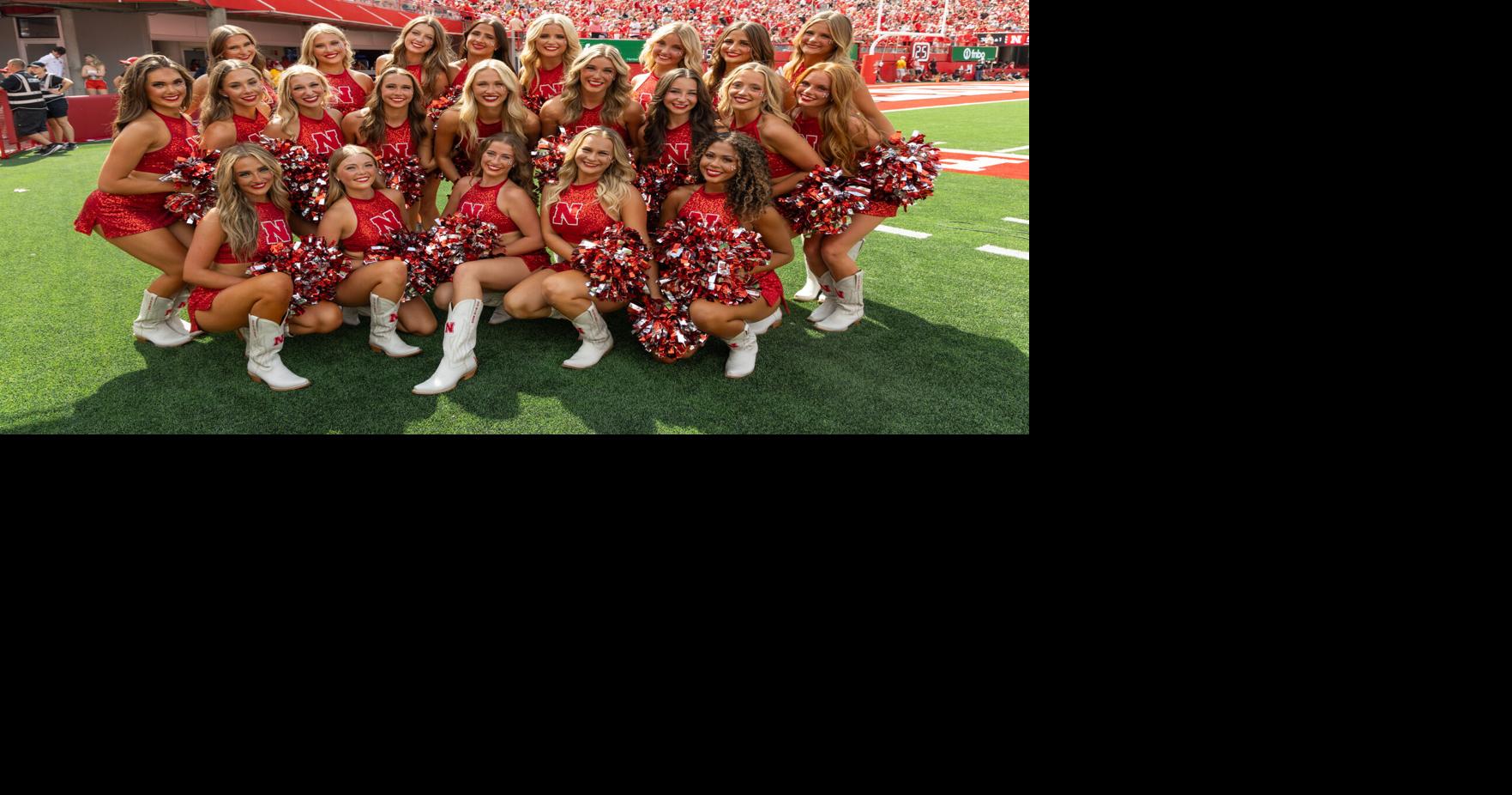 Dallas Cowboys cheerleaders help with Husker Scarlet routine