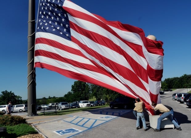 Changing big flag at Mahoney State Park takes special effort