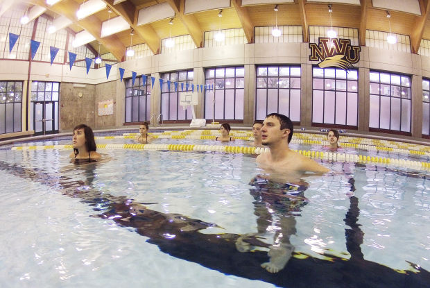 NWU students learning music conducting in the pool