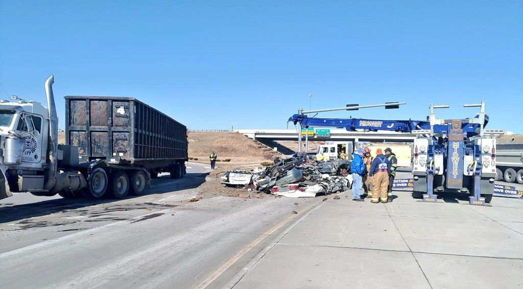 Semi tipped on its side, spilling crushed cars it was hauling in ...