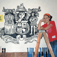 Horlick grad returns to paint Madrigal crest in choir room