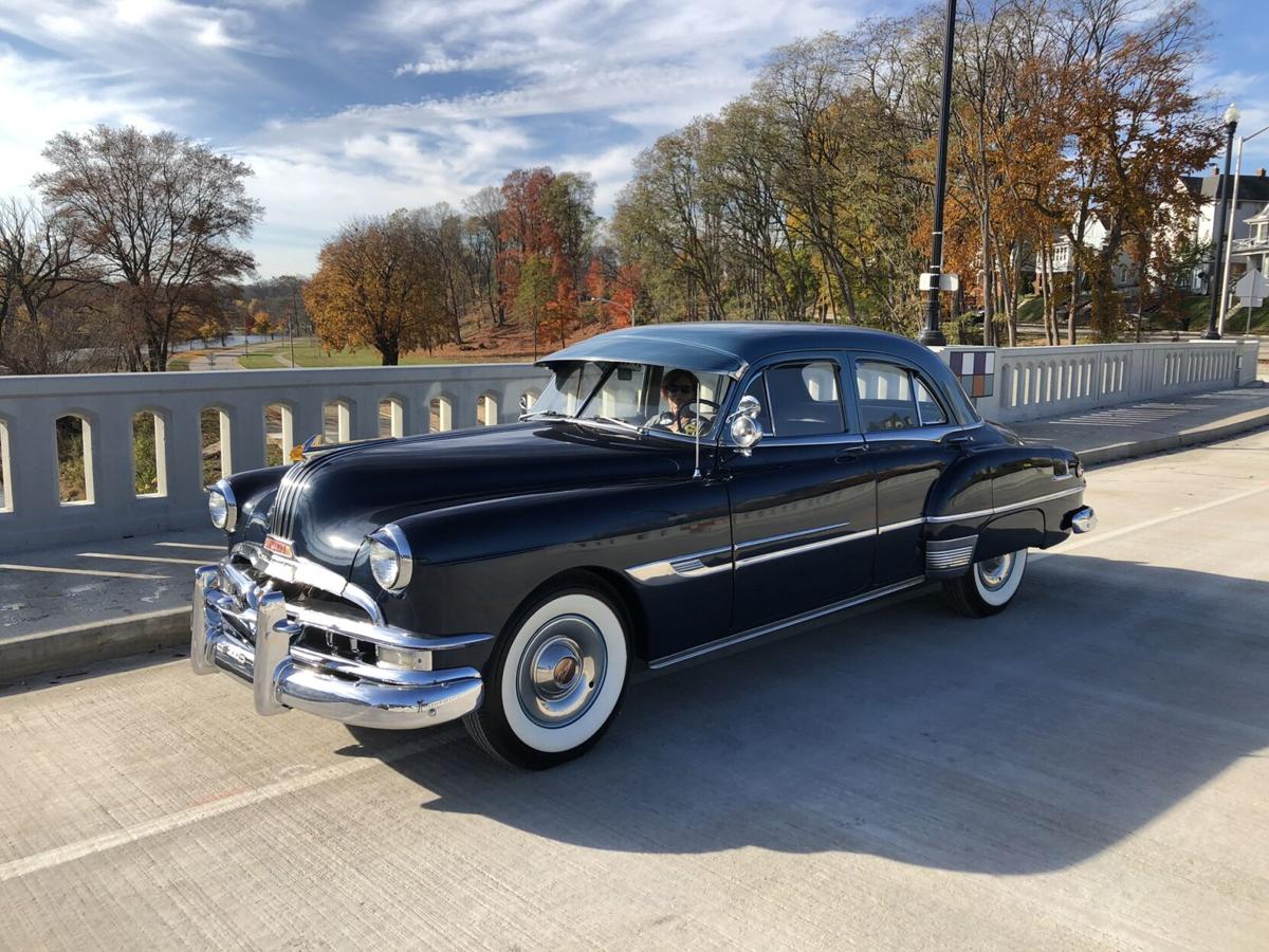 A 1952 Pontiac Chieftain was the first car to cross the reopened Sixth ...