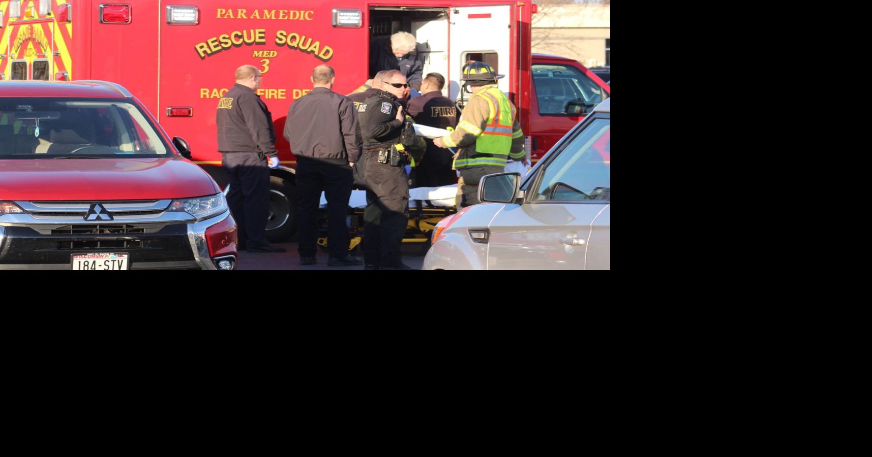 Two people struck by slow-moving vehicle in shopping center parking lot