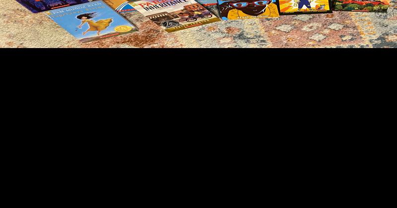 Books featuring characters of color, crayons donated to schools