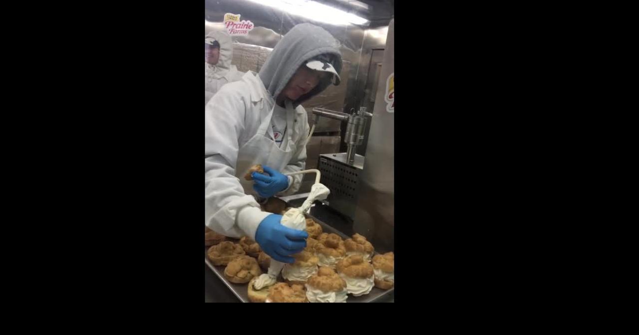 Filling cream puffs in the Original Cream Puff Pavilion at the 2022 ...
