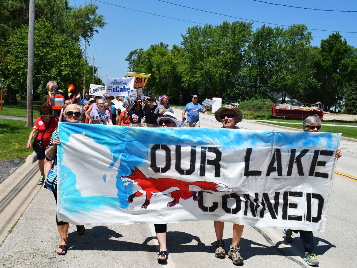 As Trump celebrates Foxconn, protesters march in Mount Pleasant