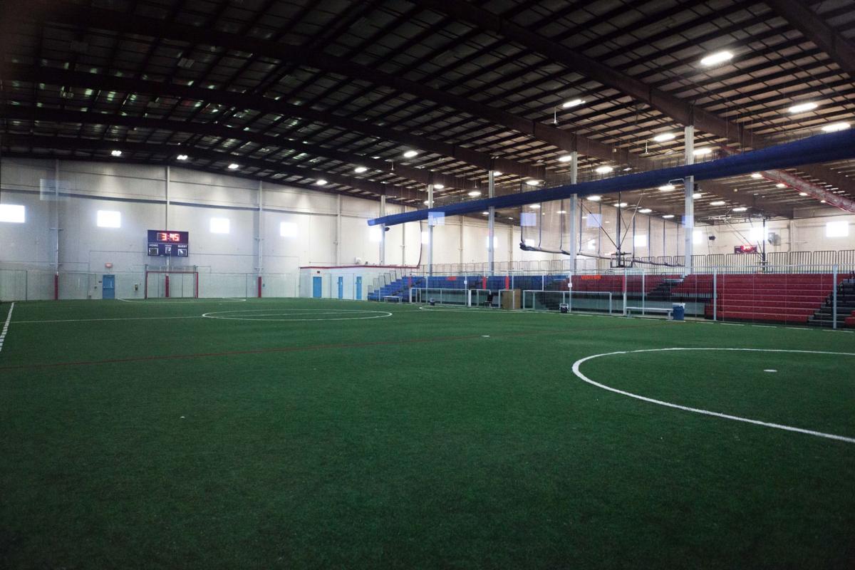 Unified board approves new turf for the REAL School fieldhouse
