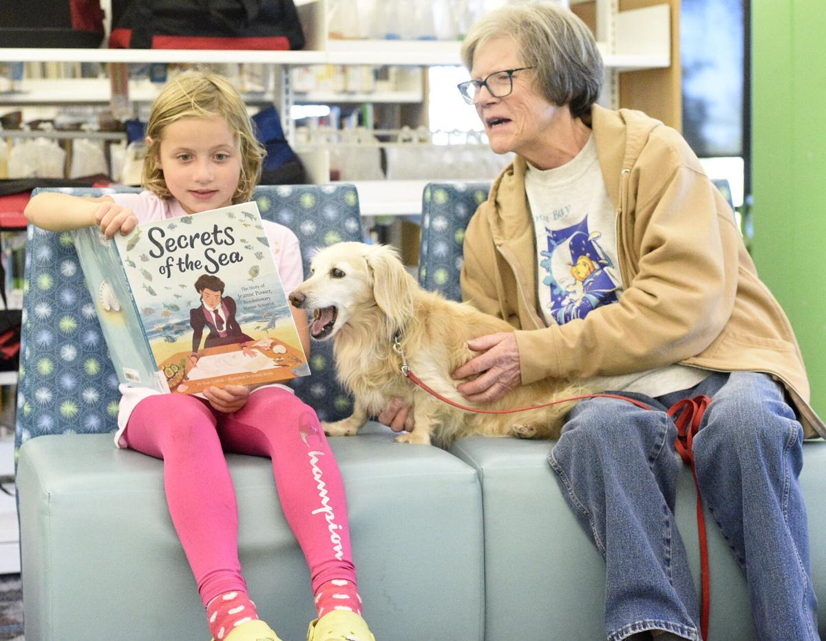 Six photos of the Ruff Readers program at the Racine Library