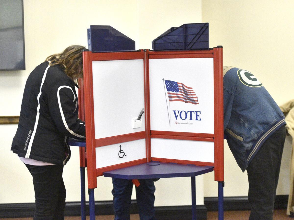 Ten photos of in-person absentee voting in Racine