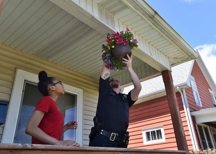 Brightening up Lakeside; COP House officers bring flower baskets to ...