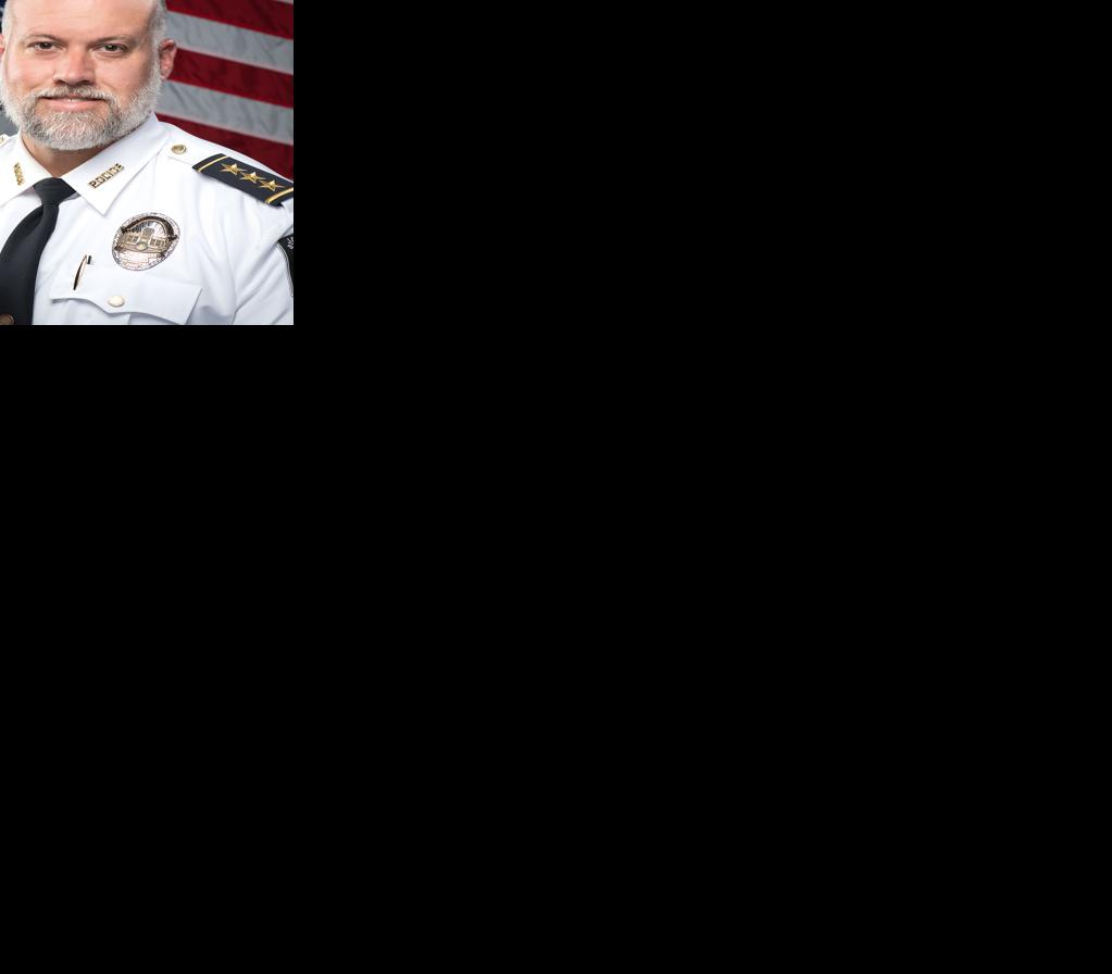 Person behind protection: Assistant Director Deputy Chief Brian Mann ...
