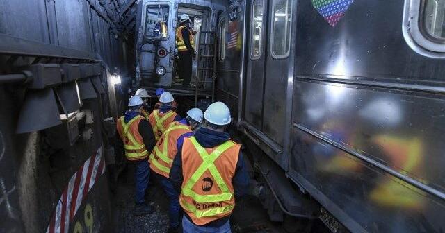 NYC subway crews wrestle derailed train back on tracks, as crash ...