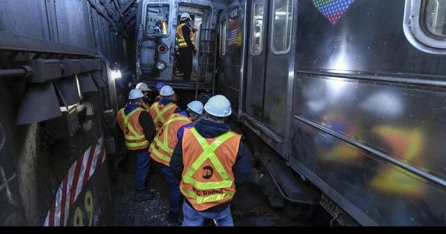 NYC subway crews wrestle derailed train back on tracks, as crash ...