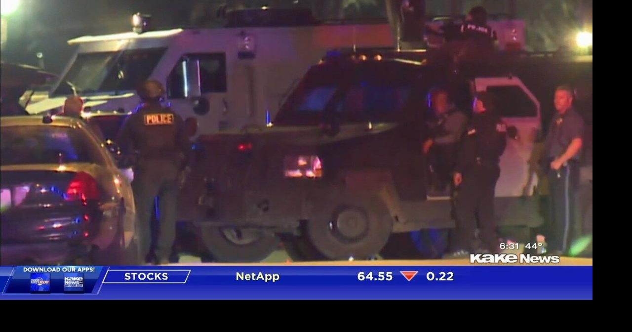 Man found dead, woman in police custody as standoff ends at Kansas City ...