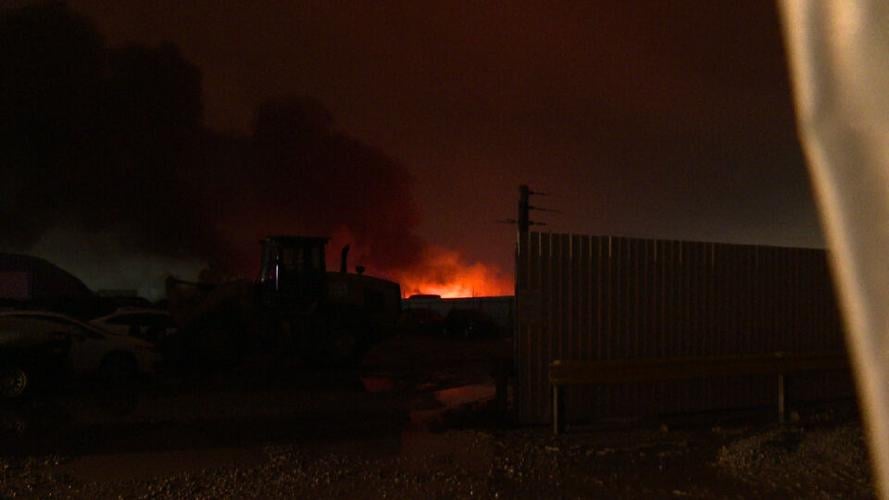 Crews battle early morning salvage yard fire; 200 cars damaged or ...