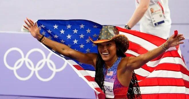 K-State assistant track and field coach wins long jump gold at Paris ...