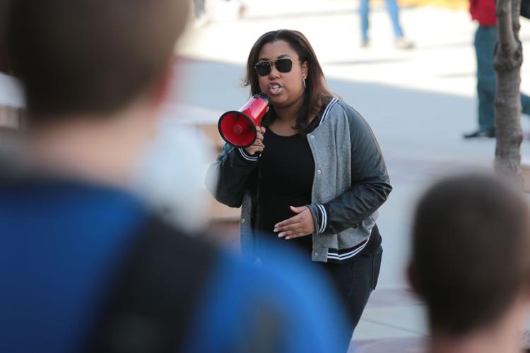Members of Rock Chalk Invisible Hawk call for solidarity during ...