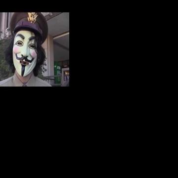 Masked man gives speech to students on Wescoe Beach at KU | Multimedia ...