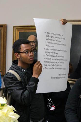 Members of Rock Chalk Invisible Hawk call for solidarity during ...