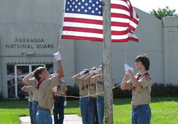 Scouts practice raising, lowering, folding flag for first-time honor