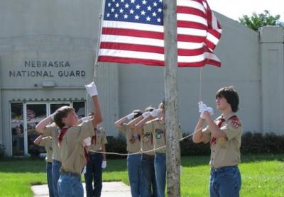 Scouts practice raising, lowering, folding flag for first-time honor