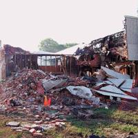 Car hits gas meter, fire destroys building in Funk