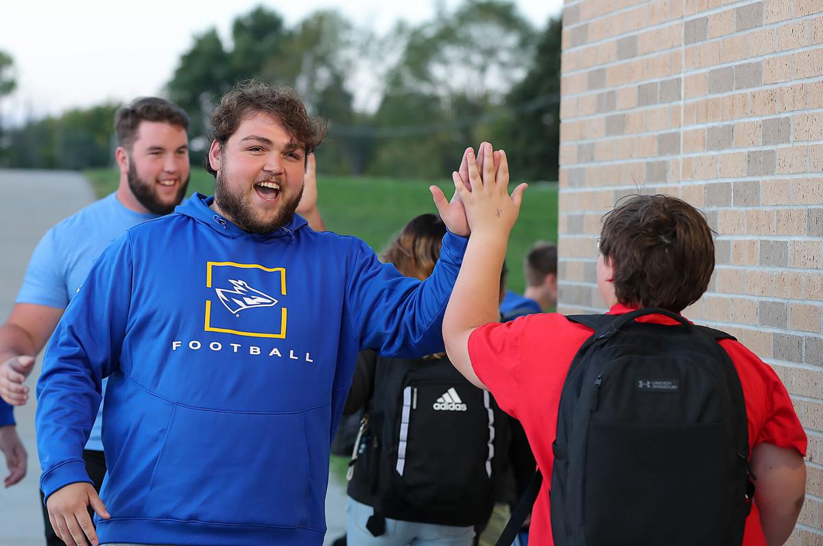 UNK student-athletes spread joy one high-five at a time