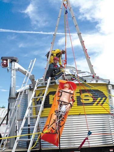 Grain rescue tube training teaches firefighters how to free trapped victims
