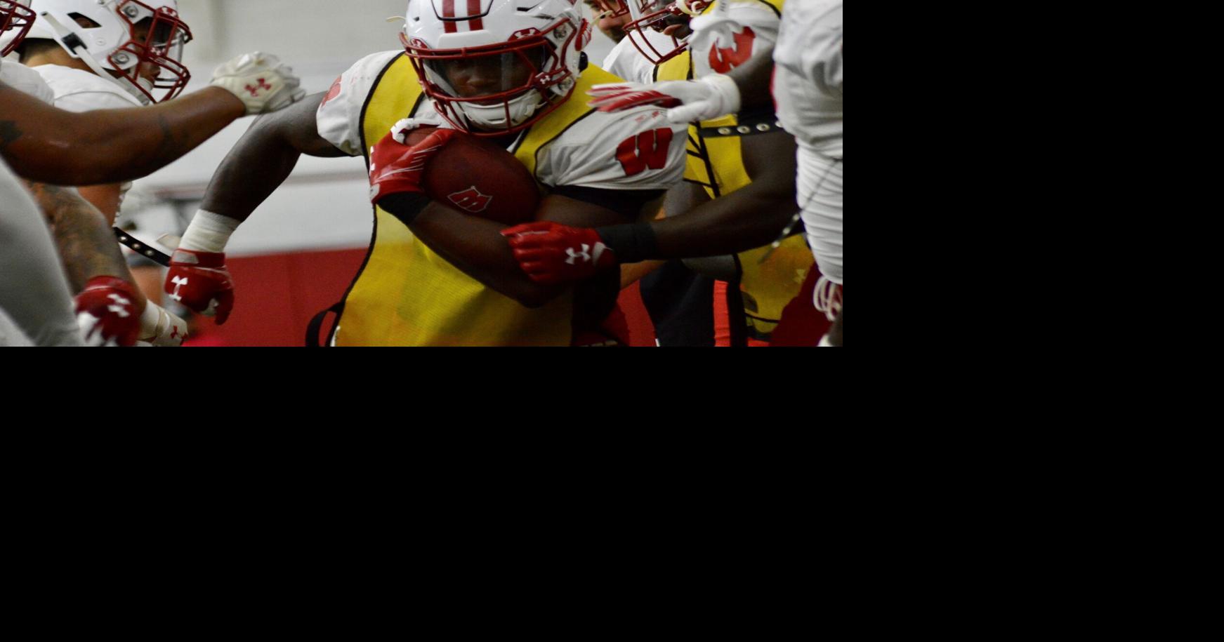 Photos: Wisconsin football moves indoors as preseason camp grind continues