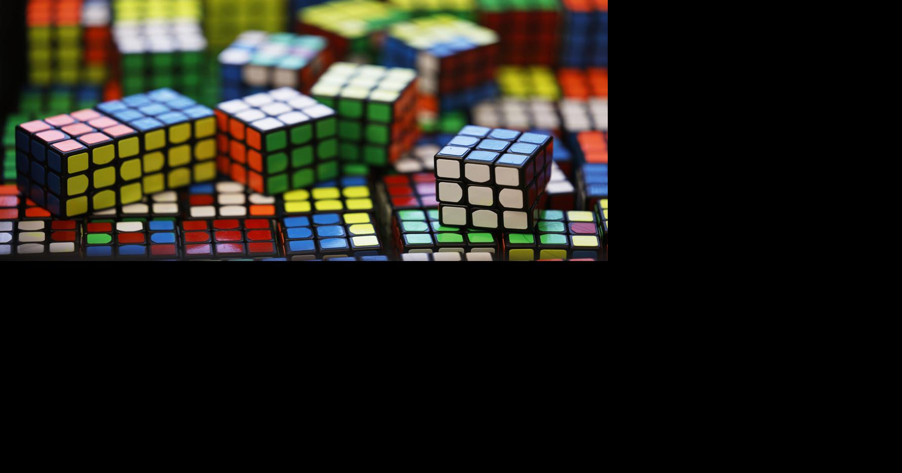 Magician builds Carthage logo mosaic out of Rubik's Cubes