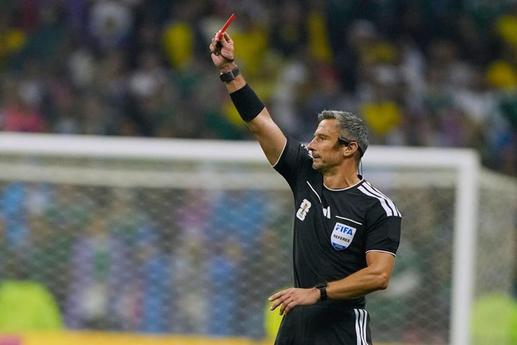 Why are World Cup refs giving red cards to players covering their ...