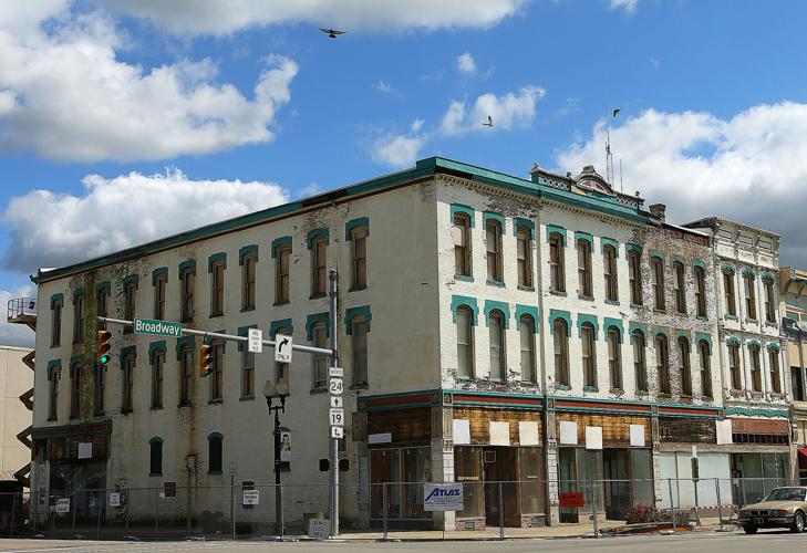 To restore an eyesore: Crews begin exterior repairs on dilapidated Peru ...