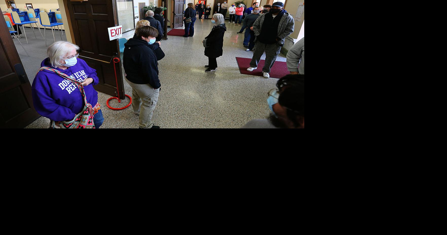 First day for in-person voting draws steady crowd | Local news ...