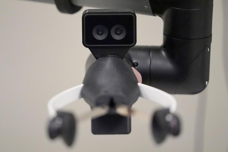 A robot is helping an ailing couple stay in their home. Are more to ...