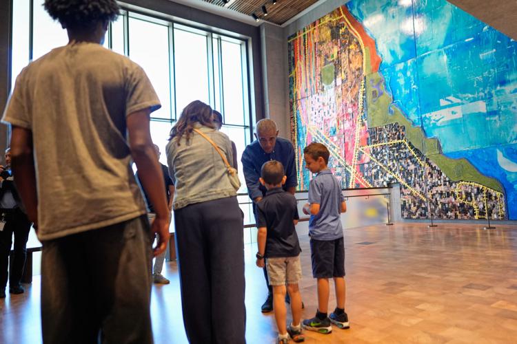 Barack and Michelle Obama surprise first visitors to newly opened ...