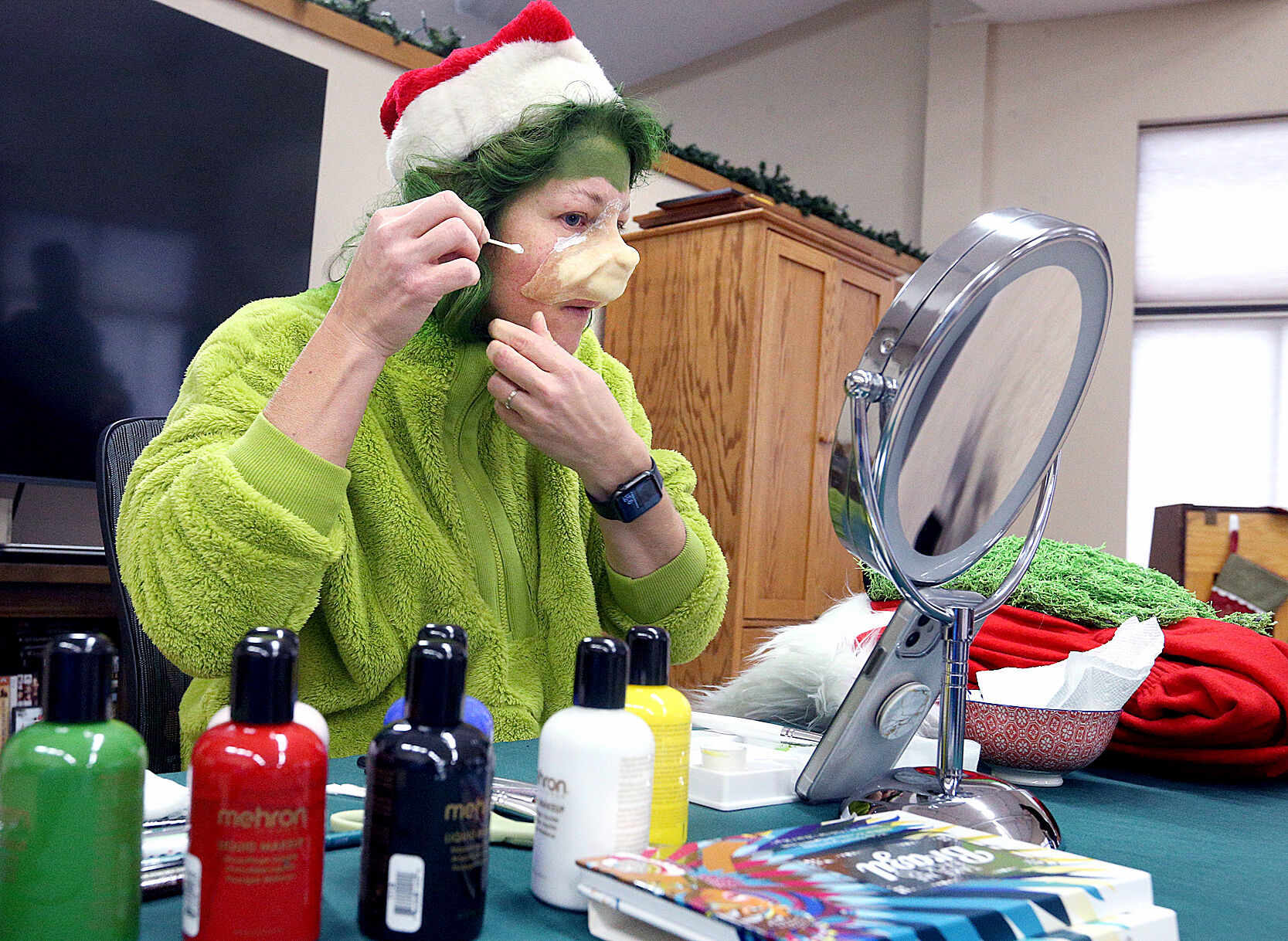IN PHOTOS: Tease owner, April Benson, becomes the Grinch at BSJ Care Center