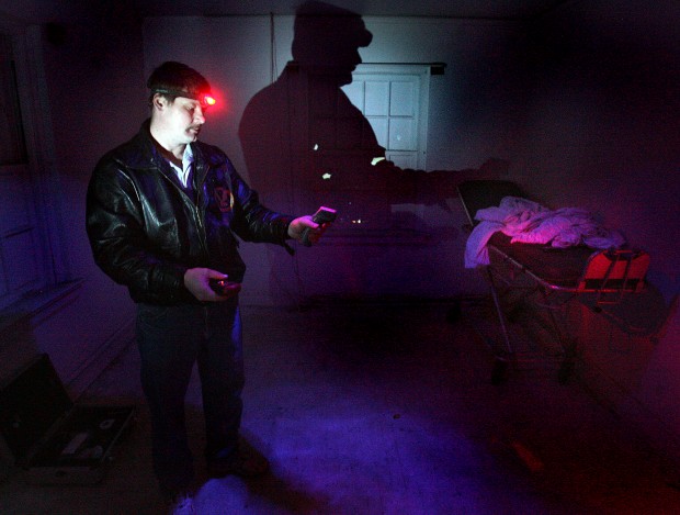 Paranormal investigators search for spirits in the night