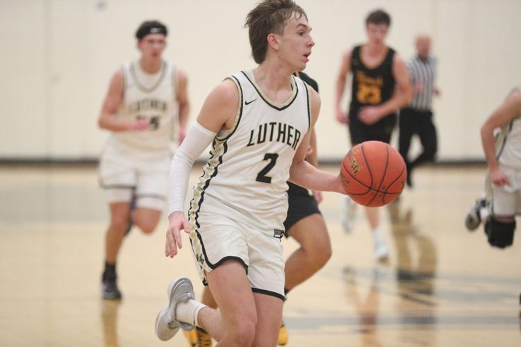 High school boys basketball: Onalaska Luther wins season debut