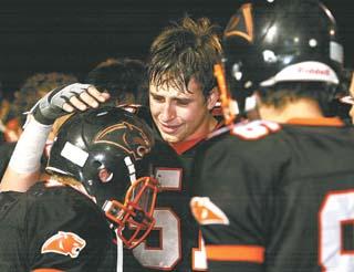 END OF THE LINE: West Salem's Ryan Rothering, center, hugs teammate ...