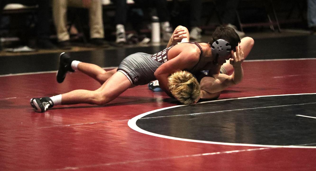 High school wrestling: La Crosse Aquinas goes for two straight over Holmen